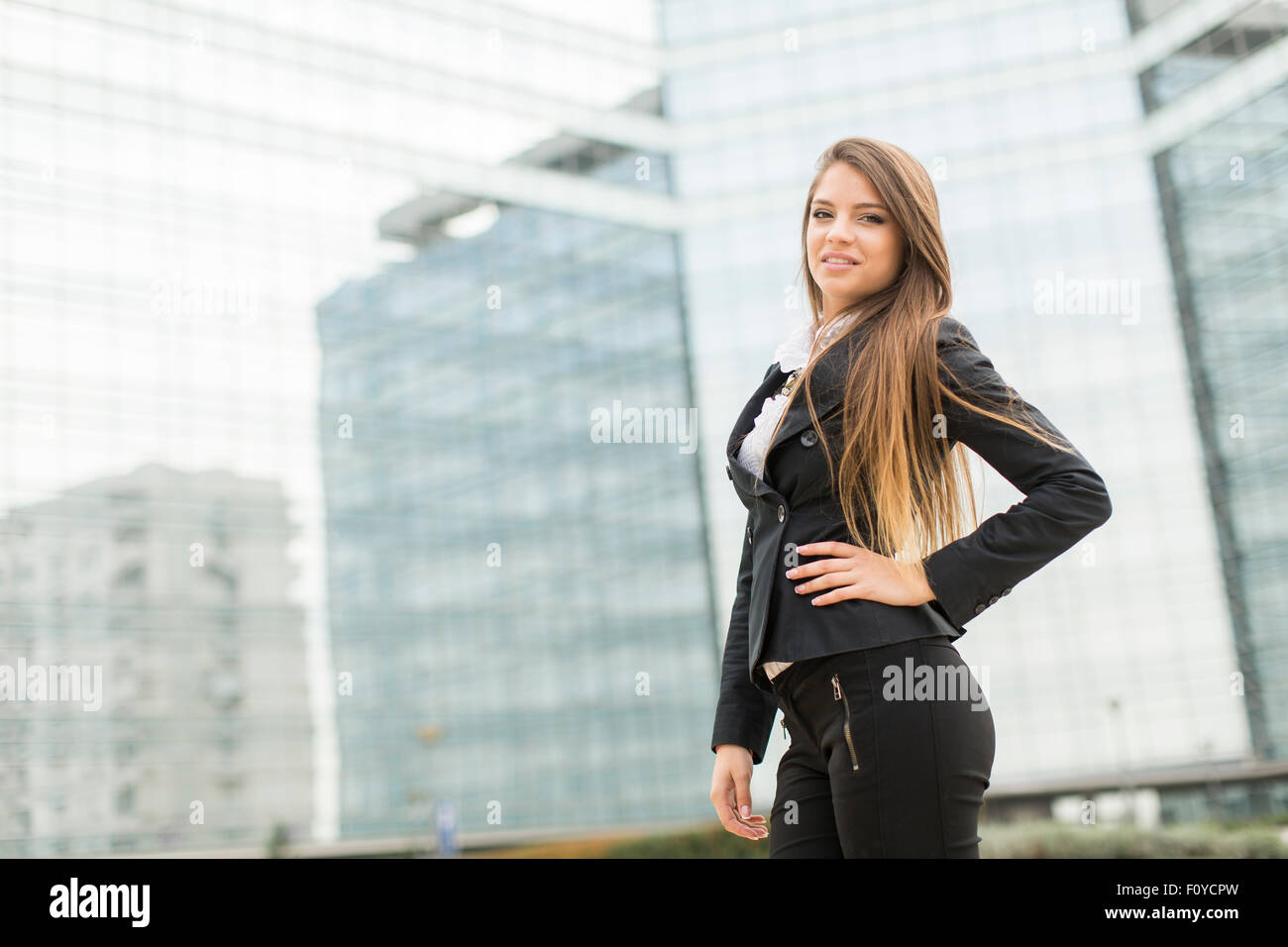 Pretty woman standing in front of building hi-res stock photography and ...