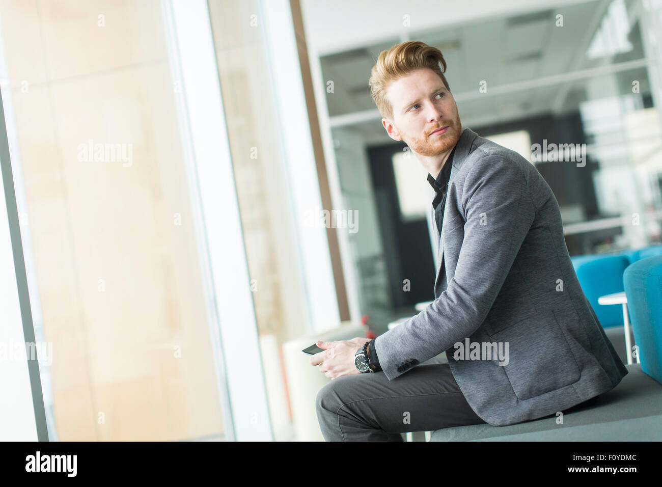 Young man in the office Stock Photo - Alamy