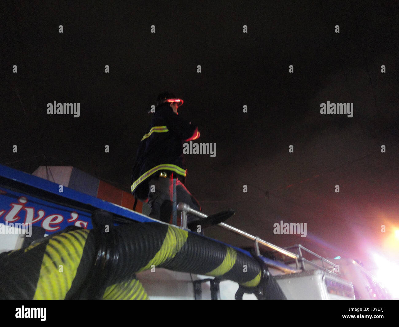 Quezon City, Philippines. 23rd Aug, 2015. A fireman records his ...
