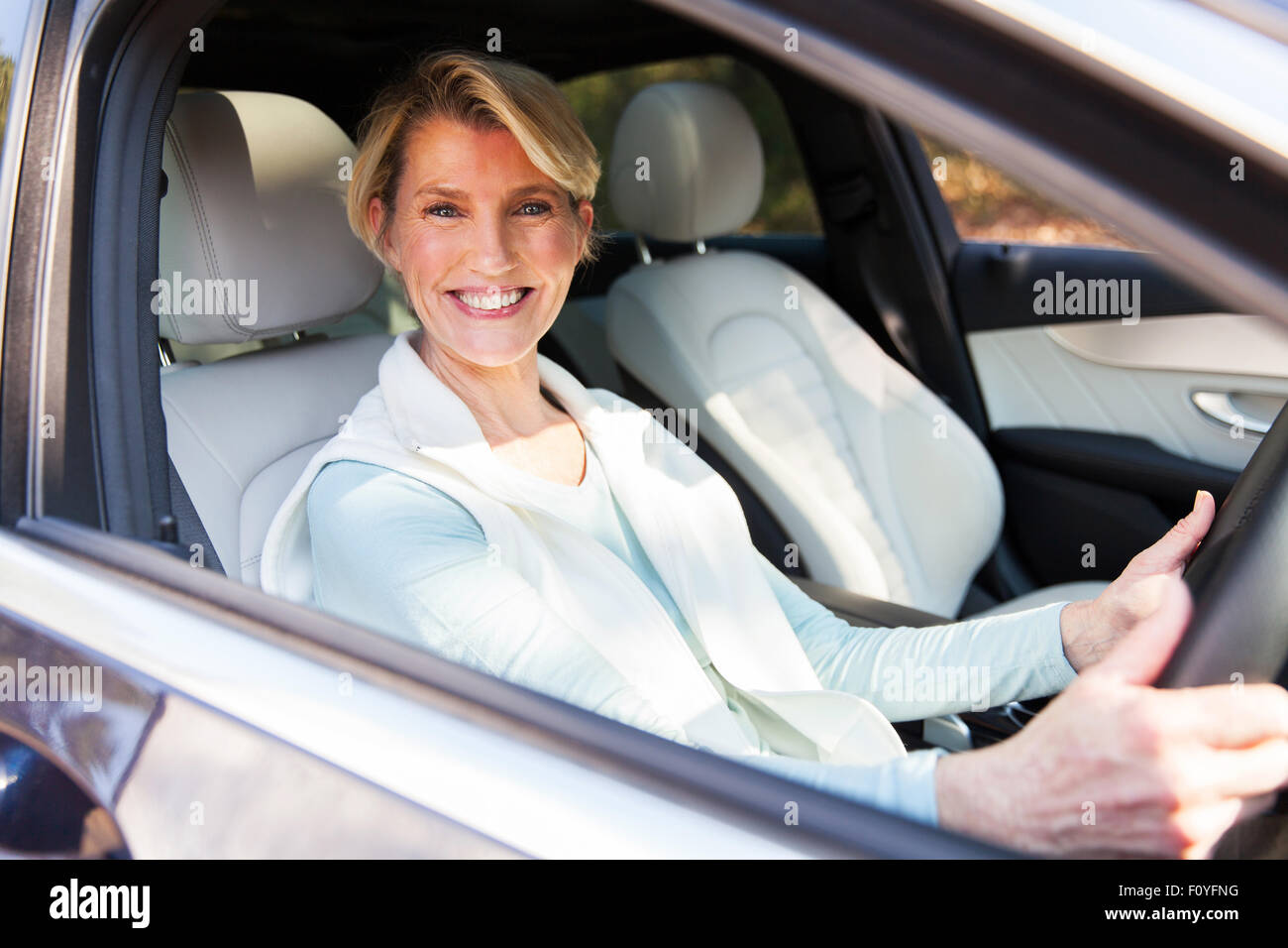 Mature woman driving car hi-res stock photography and images - Alamy