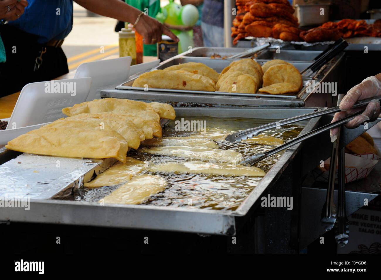 Deep fried tortillas cooking at a Mexican festival Stock Photo - Alamy