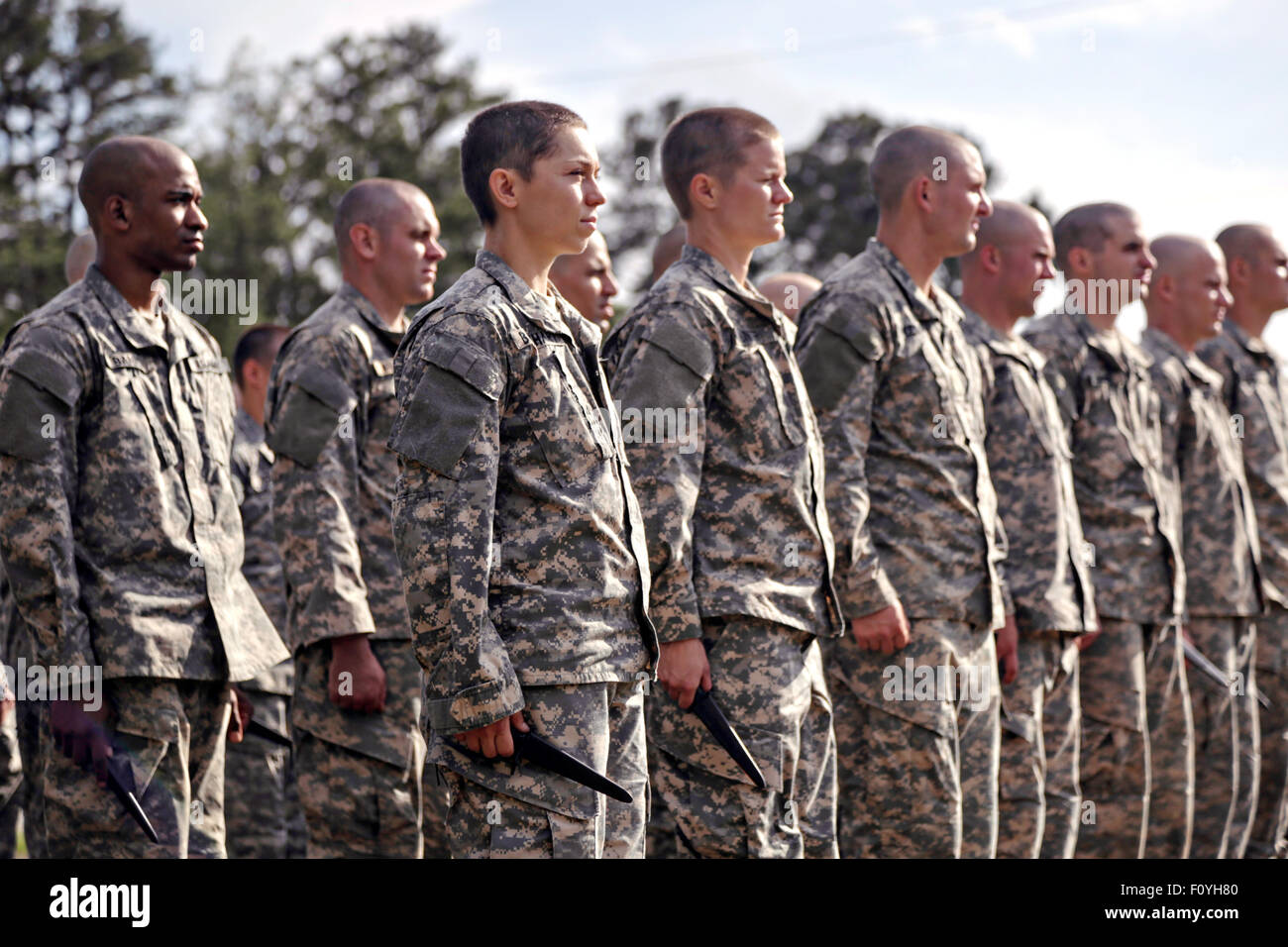 U.S. Army soldiers including the first group of women candidates stand ...