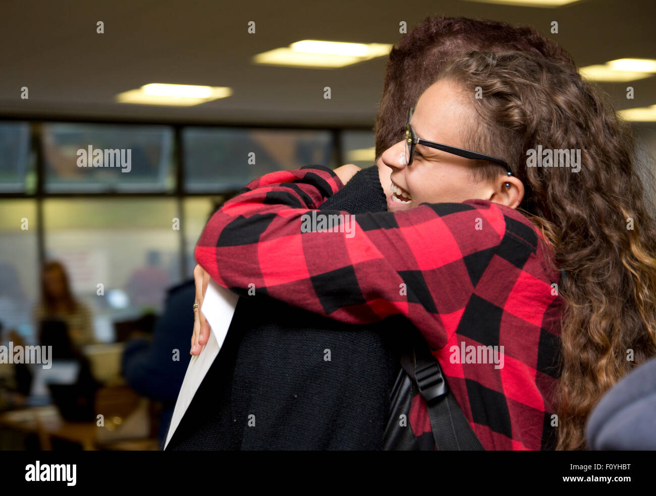 Students collecting A level results and successfully getting into ...
