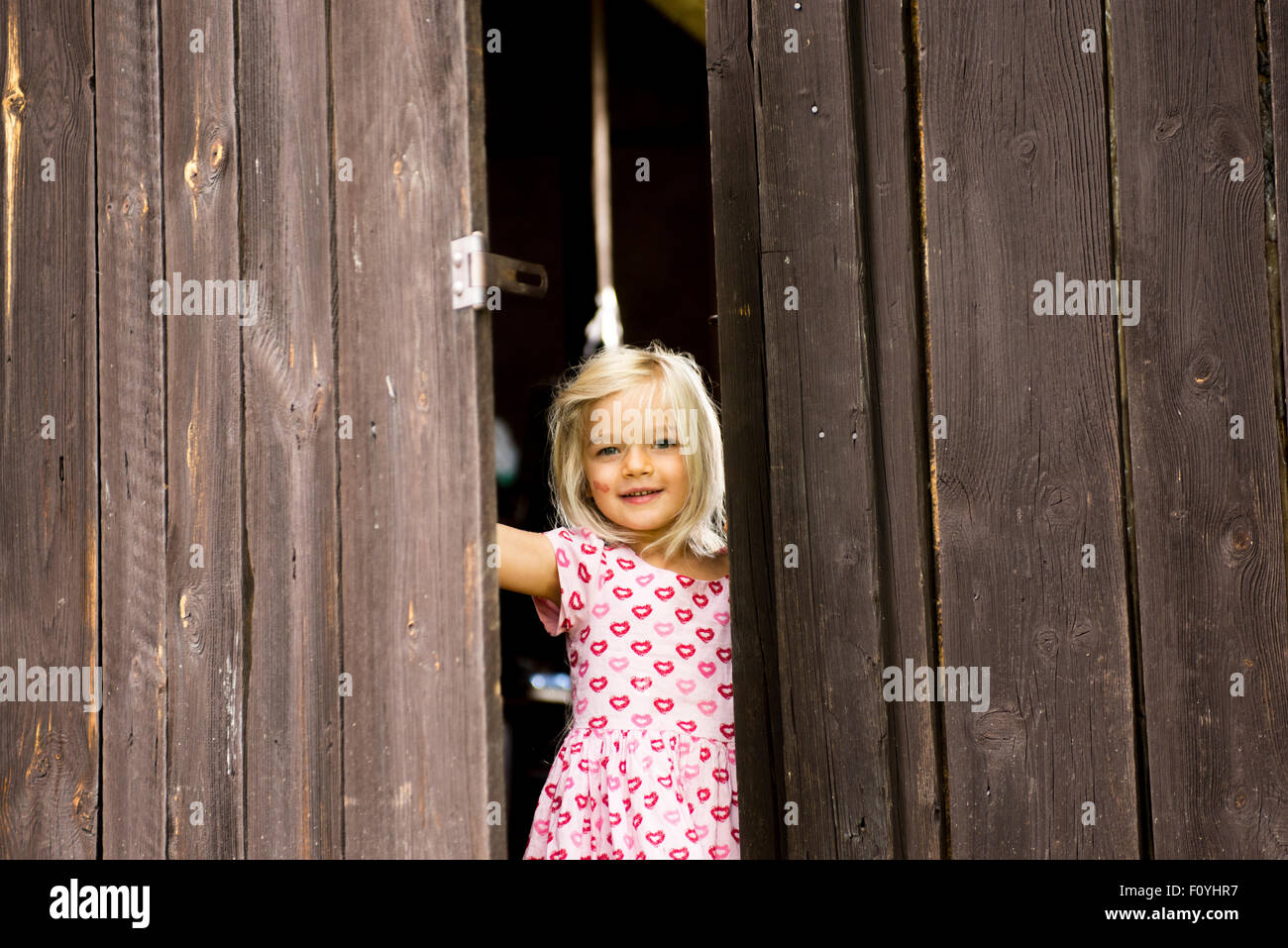 Girl by wooden gate hi-res stock photography and images - Alamy
