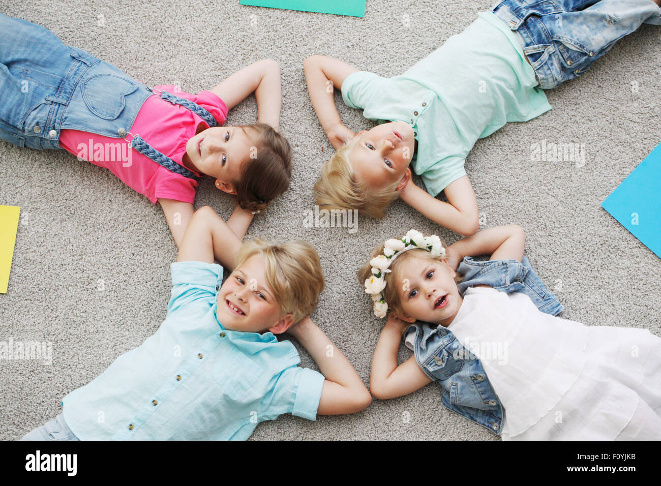 happy kids lying on the floor Stock Photo - Alamy