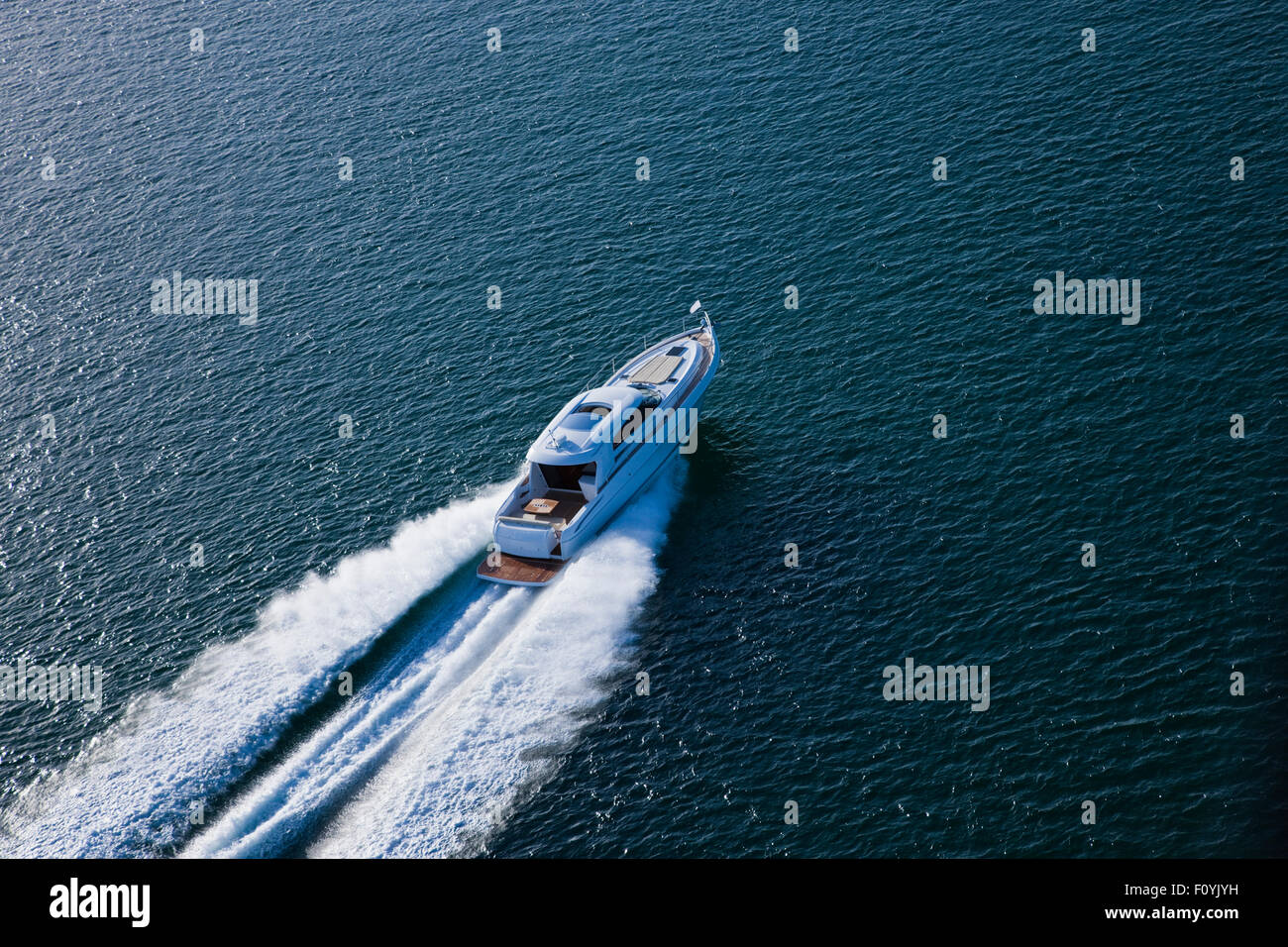 Beautiful speed boat sailing through the sea on a bright sunny day ...