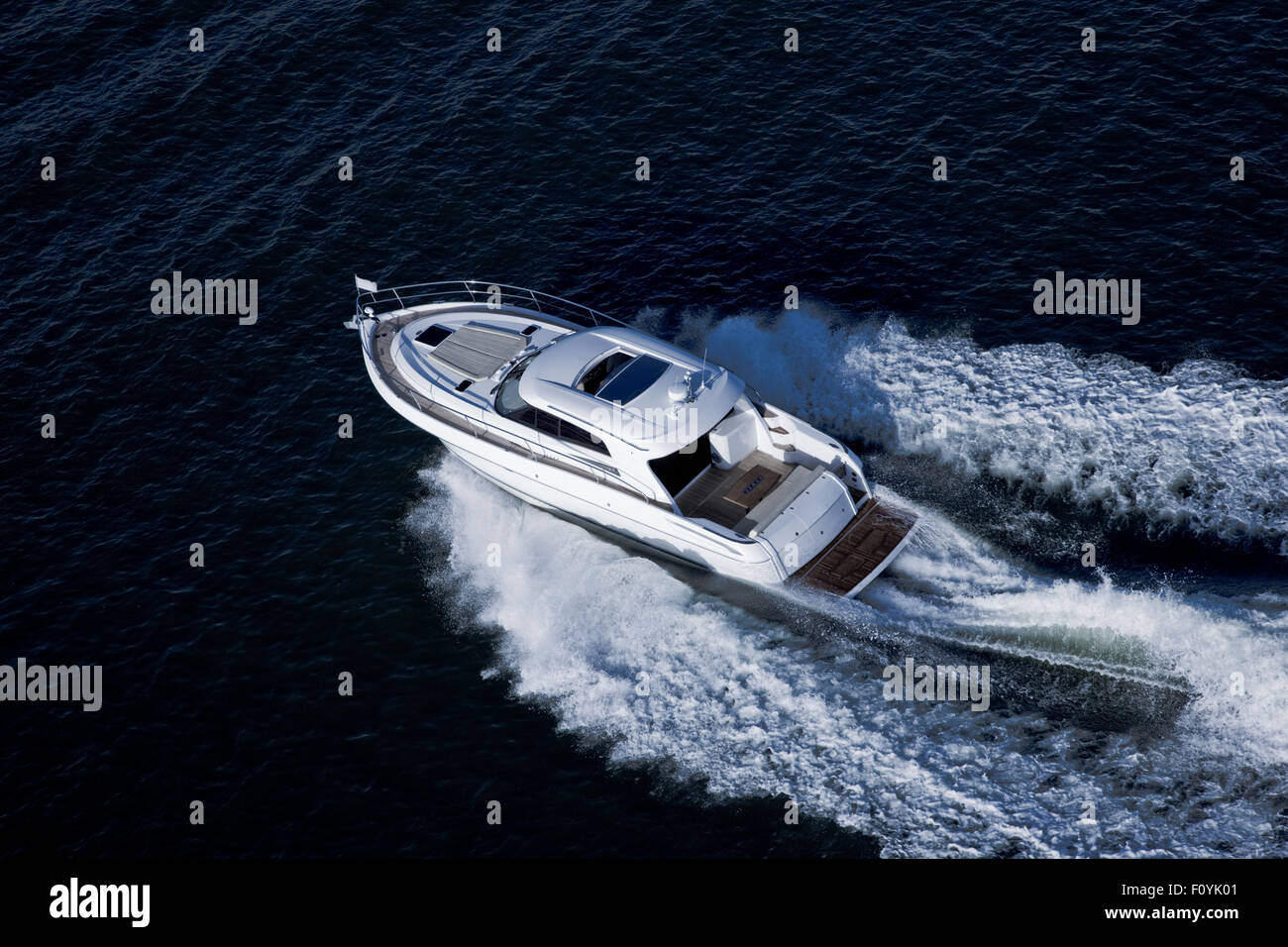 Elegant speed boat sailing with big speed in a dark sea Stock Photo - Alamy