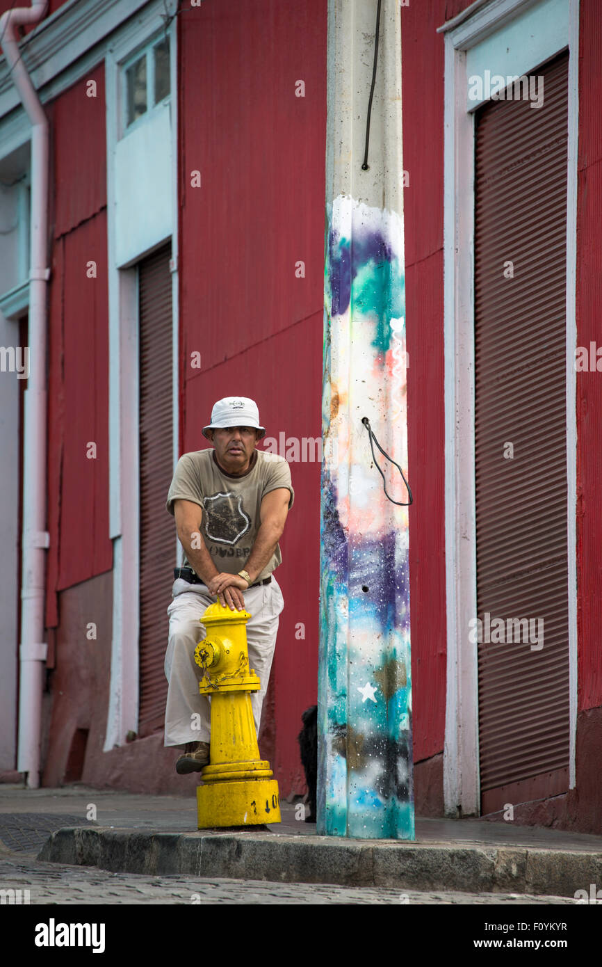 Man and fire hydrant, Valparaiso, Chile Stock Photo - Alamy