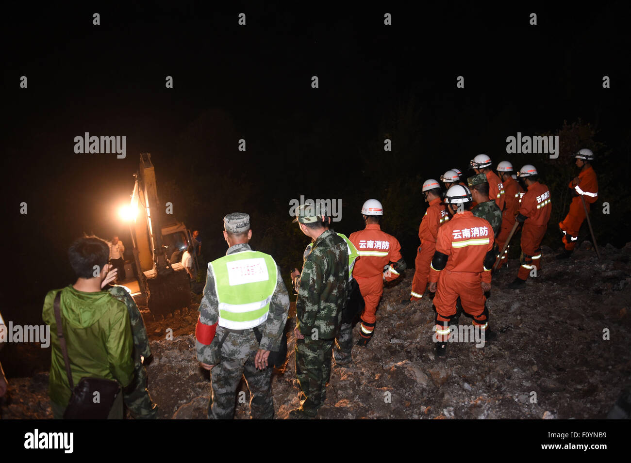 Funing, China's Yunnan Province. 23rd Aug, 2015. Rescuers search for ...