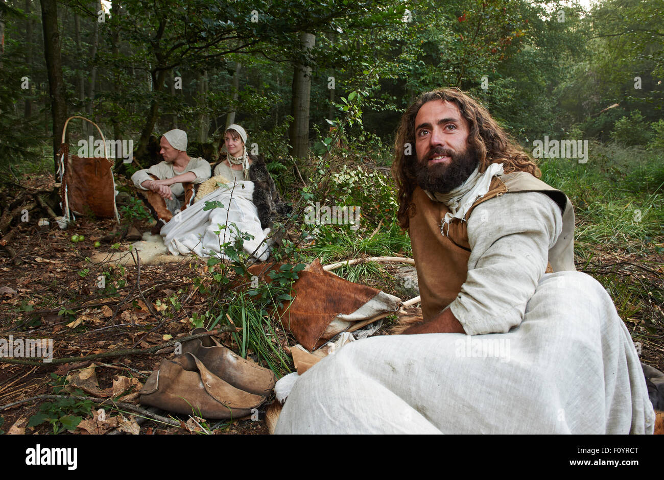 'Stone Age travelers' Marco and Veronica squatting on their bivouac of ...