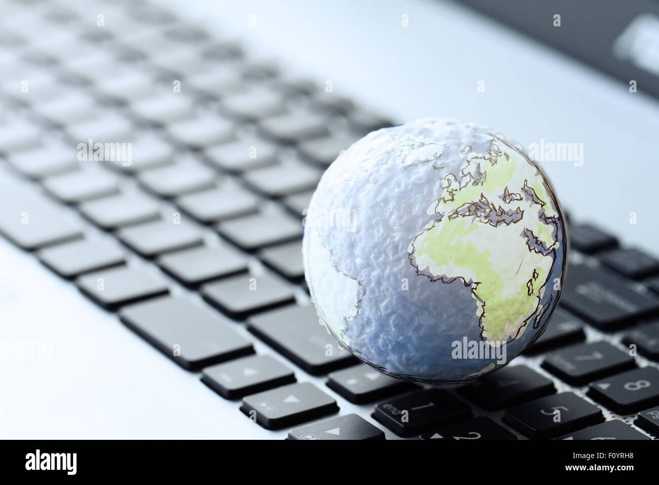 hand drawn texture globe on laptop computer as internet concept Stock ...
