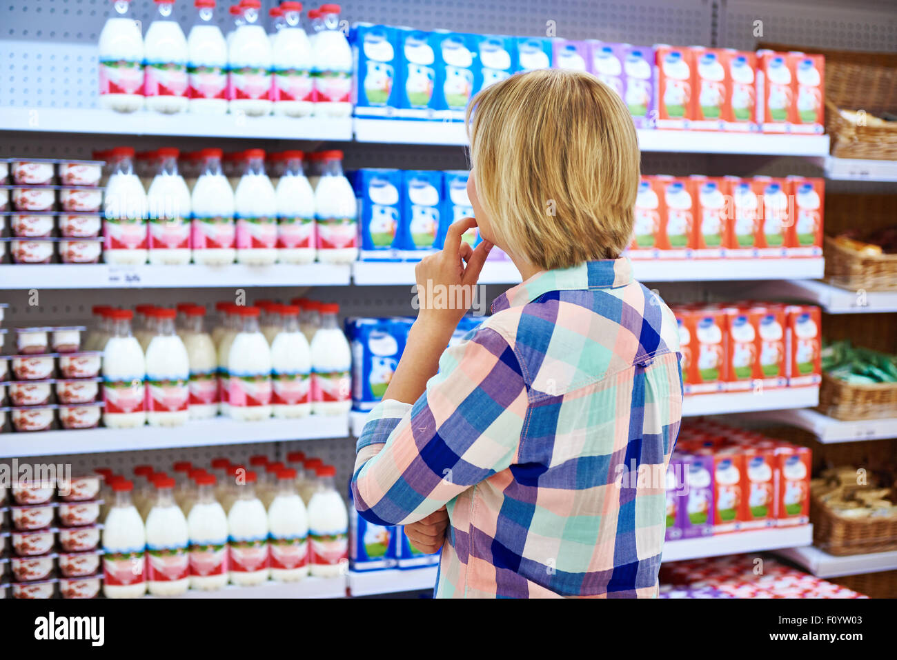 Woman buying grocery products hi-res stock photography and images - Alamy