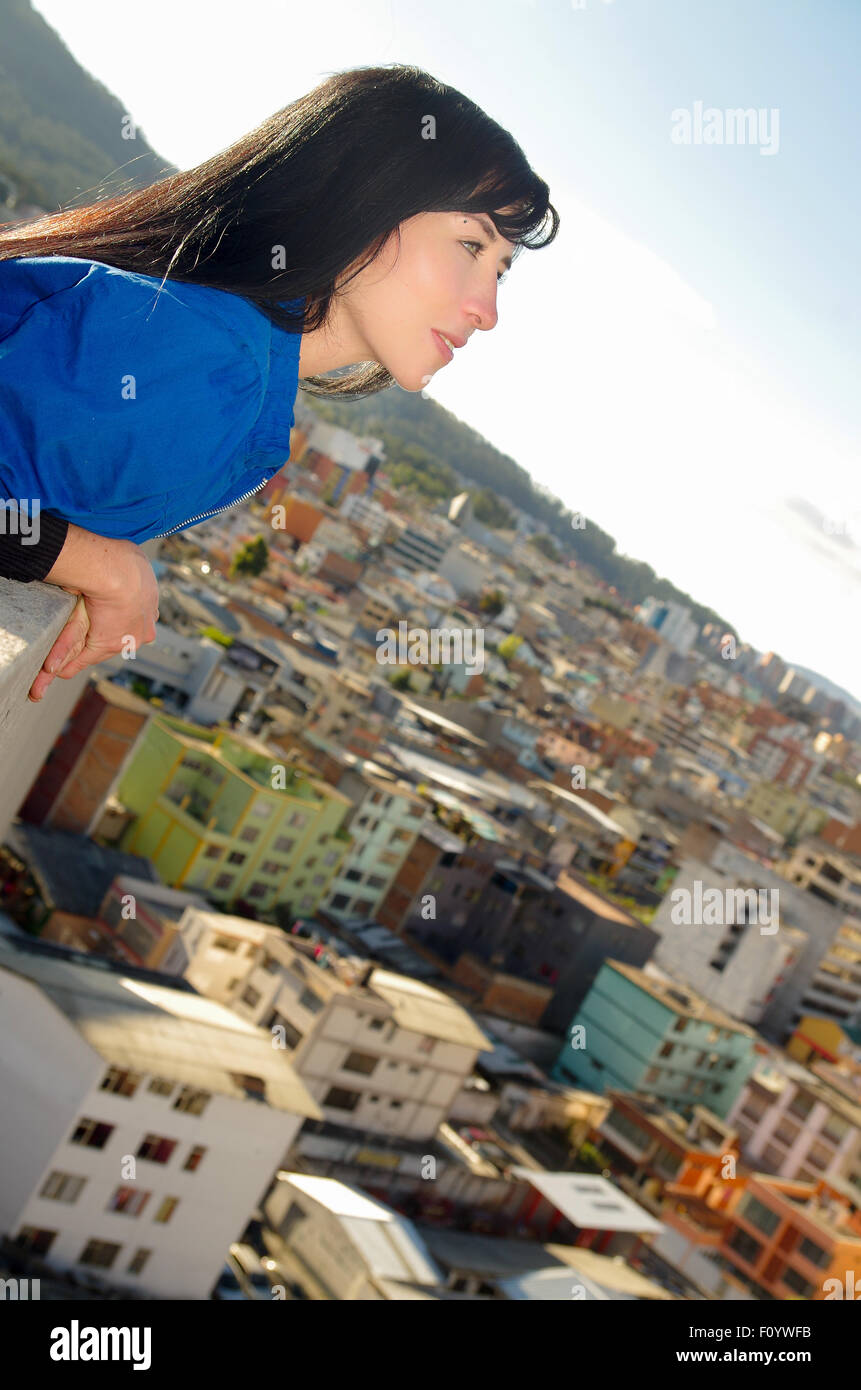 Beautiful young happy girl contemplating the city from a terrace Stock ...