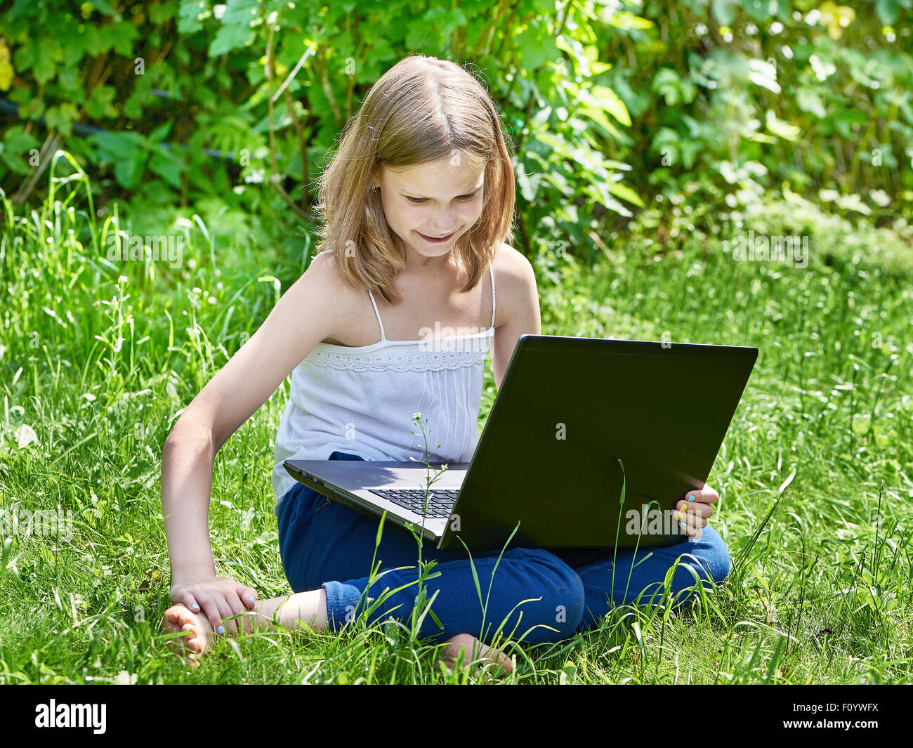 Girl teenager grass hi-res stock photography and images - Alamy