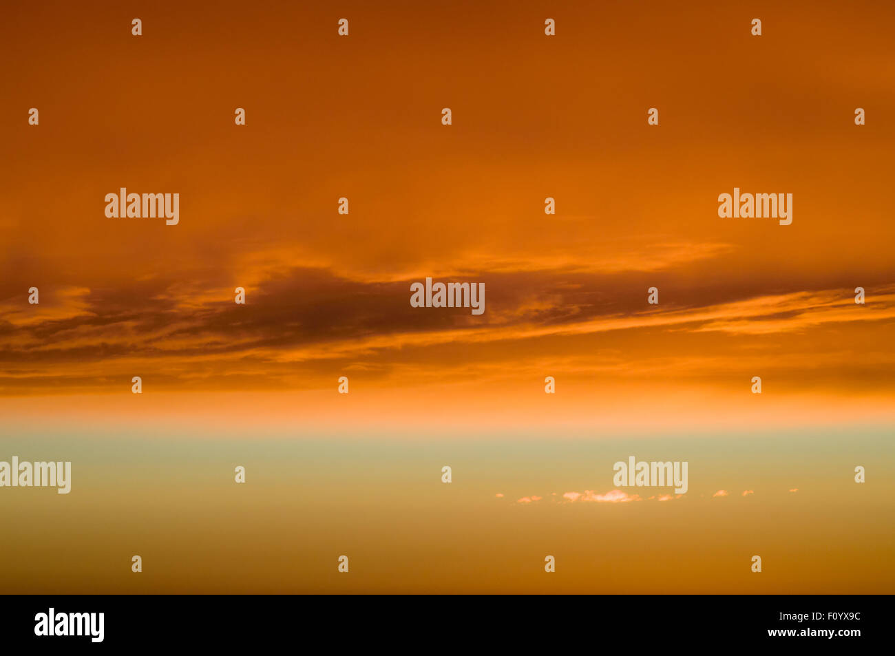 Fiery orange clouds and dramatic golden sky, sunset background Stock ...