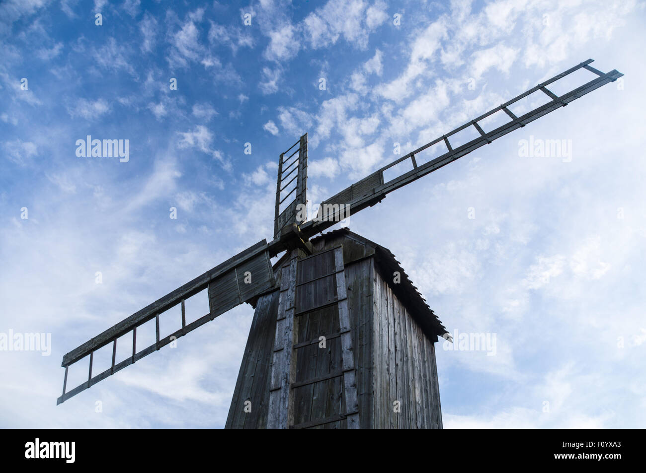 Wooden windmill from below against blue sky, wide angle view Stock ...