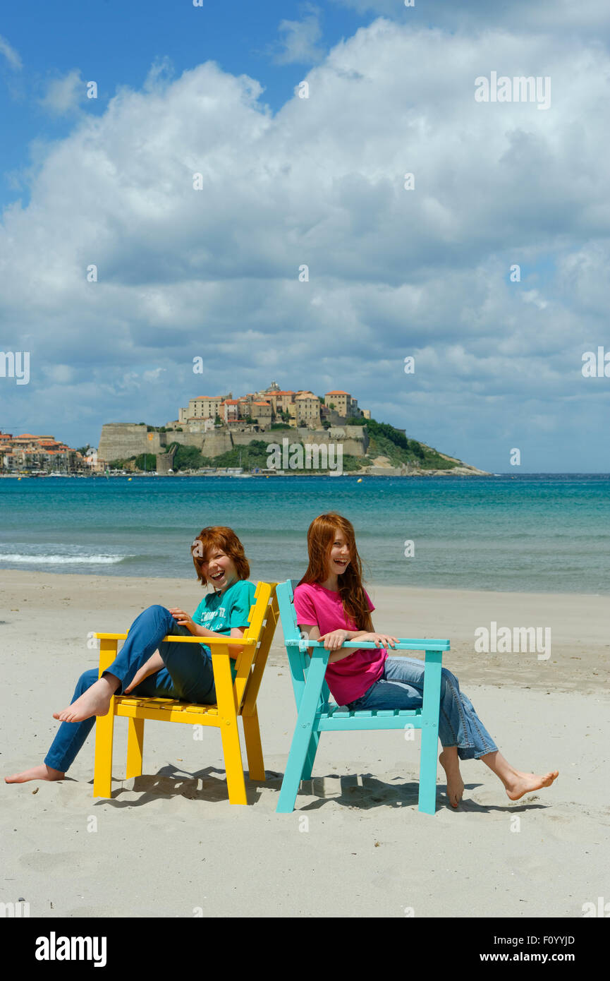 People Sitting In Beach Chairs High Resolution Stock Photography and ...