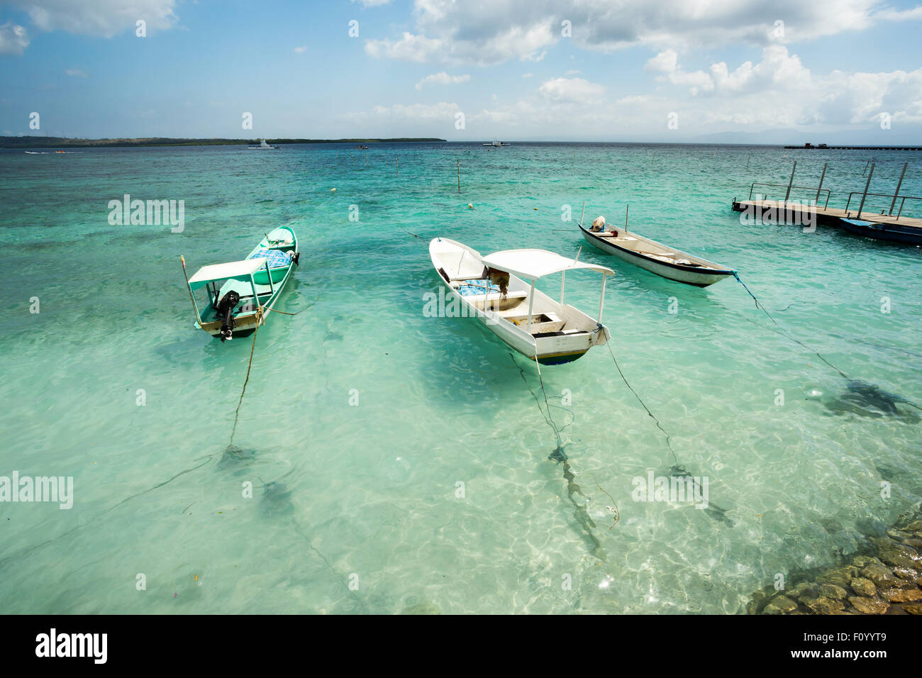 romantic Small boats on nusa penida beach, Bali Indonesia with blue sky ...