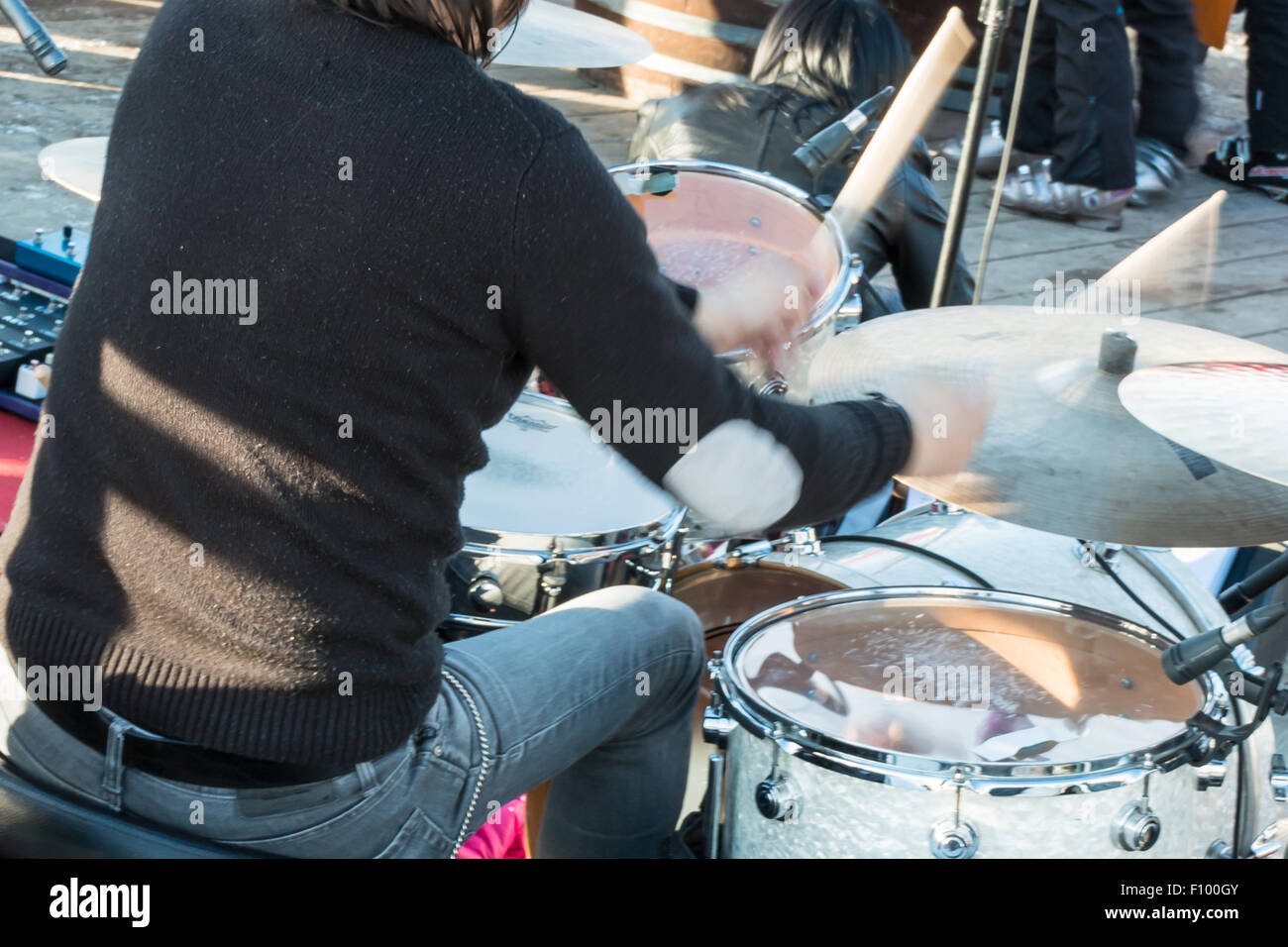 black hair drummer during outdoor concert: rear view Stock Photo - Alamy