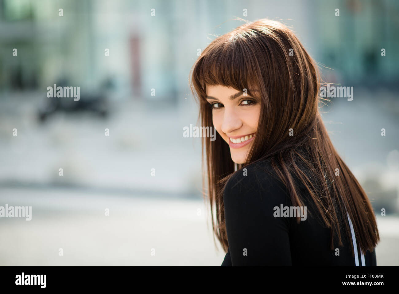 Girl looking back over shoulder hi-res stock photography and images - Alamy