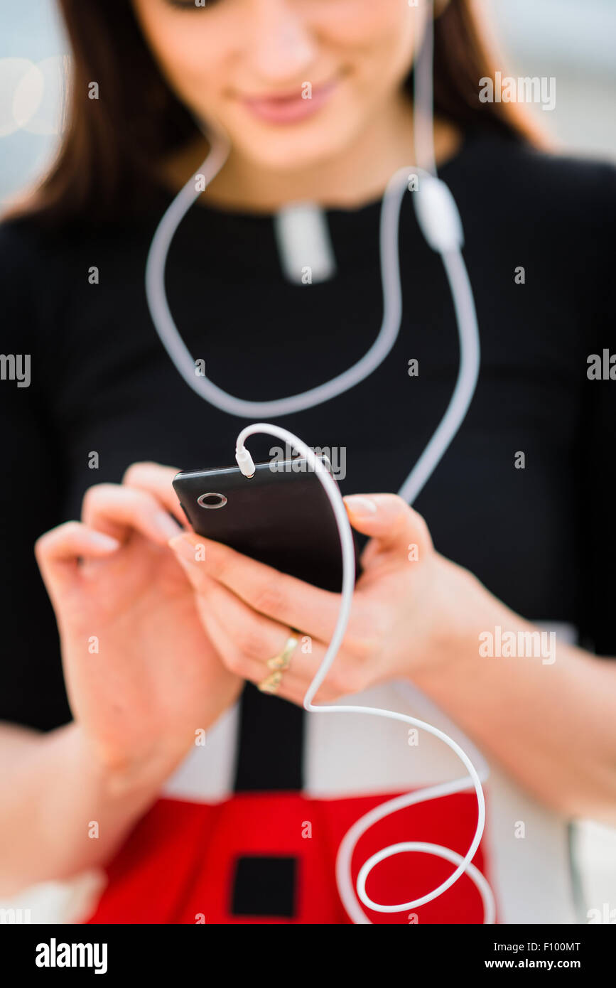 Detail of young woman browsing internet on her smartphone Stock Photo ...