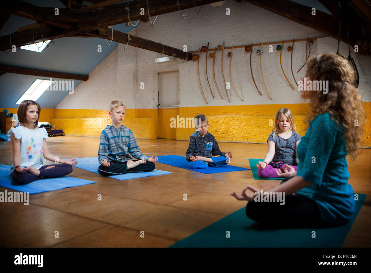 CHILD PRACTICING YOGA Stock Photo - Alamy