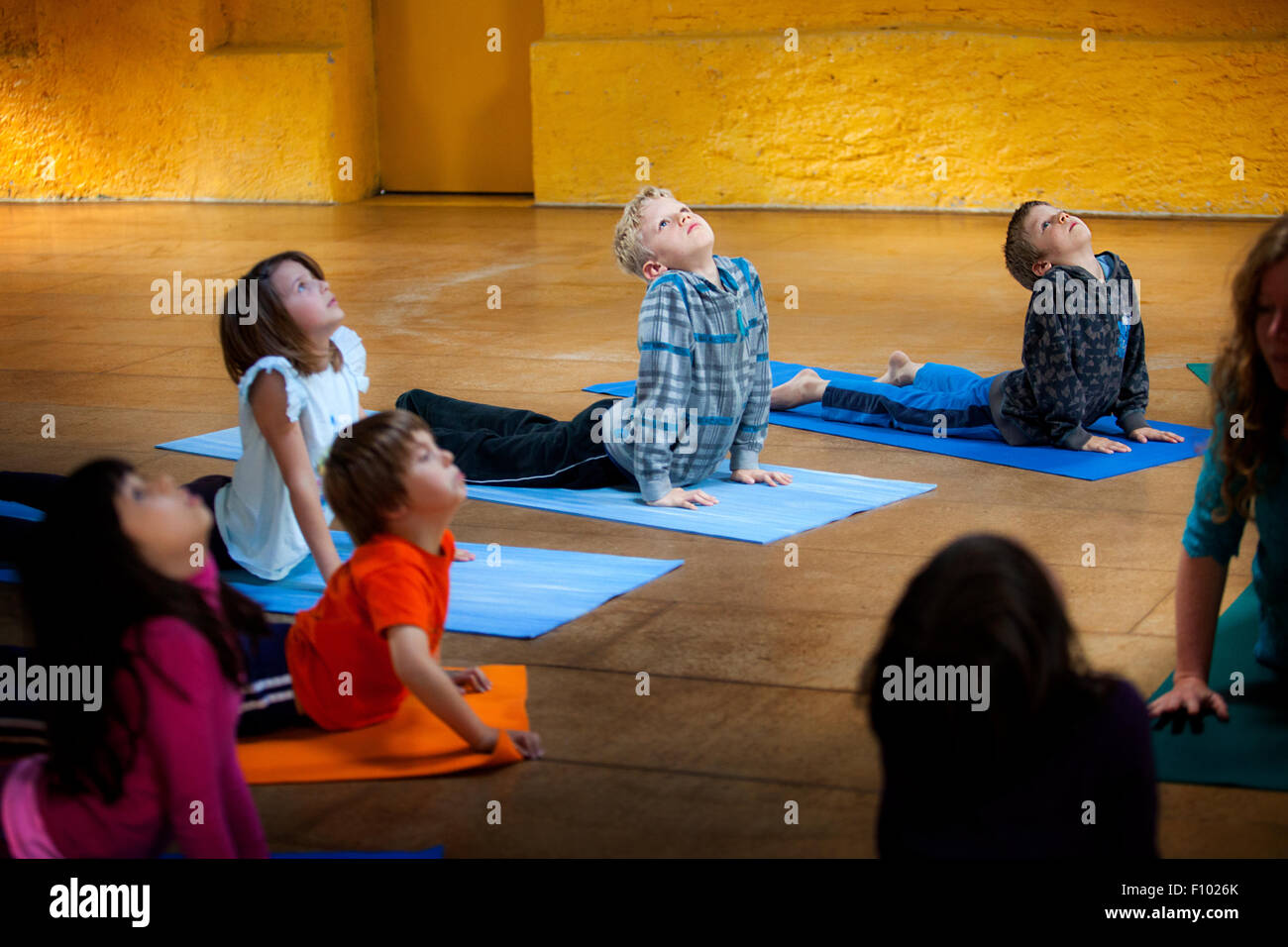 CHILD PRACTICING YOGA Stock Photo - Alamy
