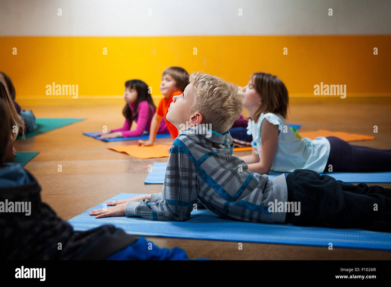 CHILD PRACTICING YOGA Stock Photo - Alamy