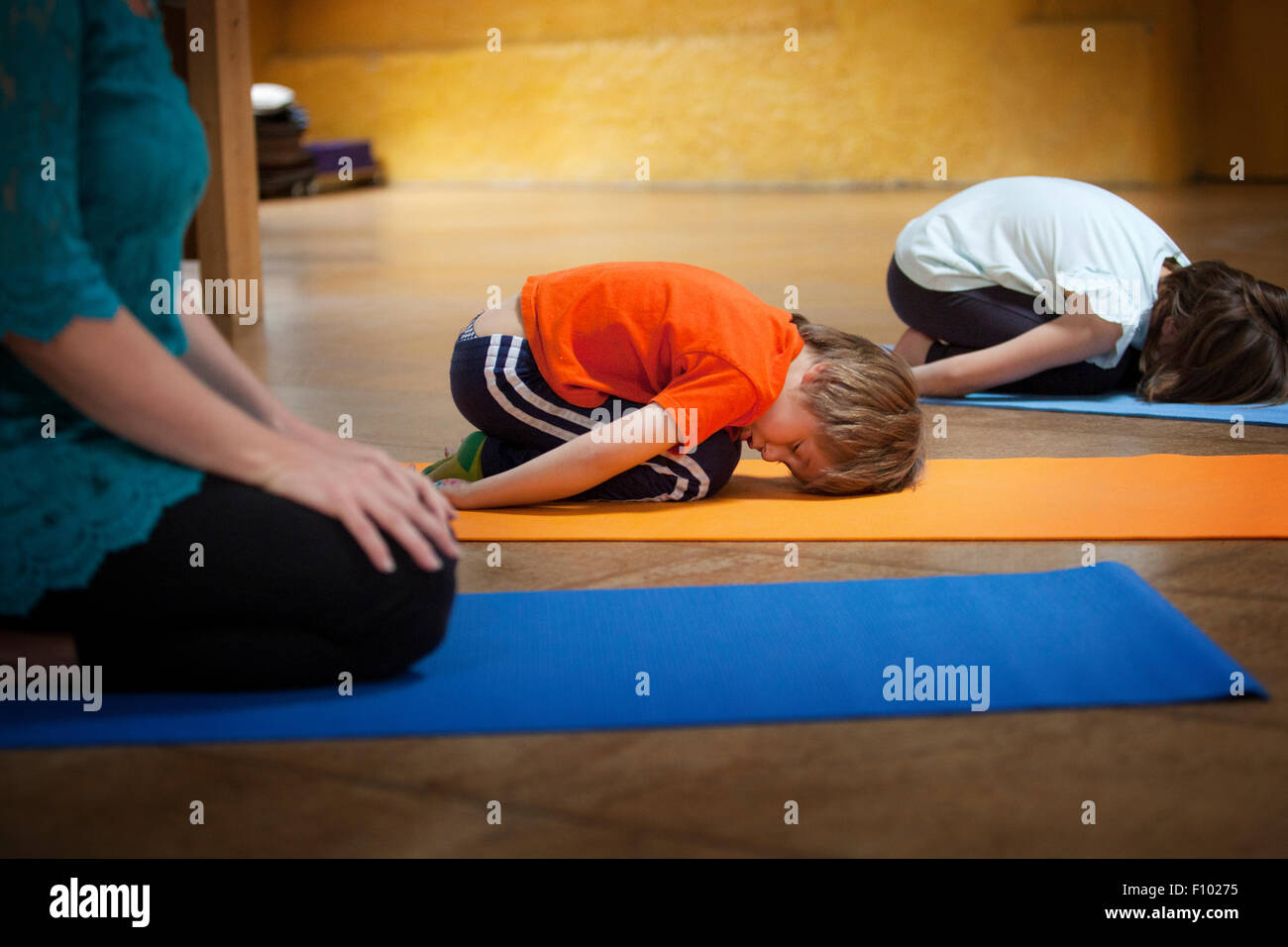 CHILD PRACTICING YOGA Stock Photo - Alamy