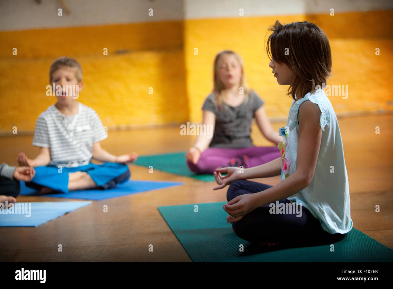 CHILD PRACTICING YOGA Stock Photo - Alamy