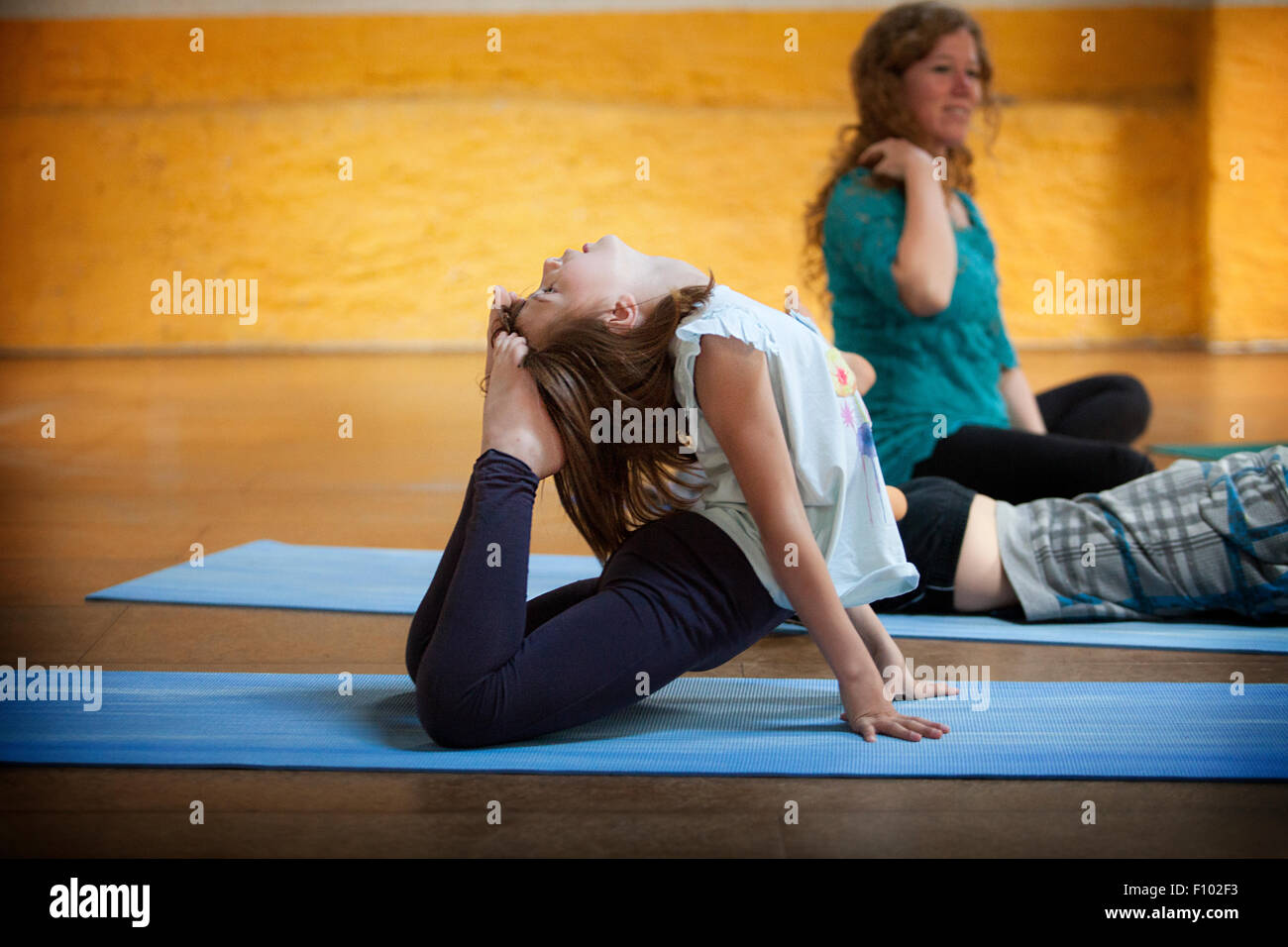 CHILD PRACTICING YOGA Stock Photo - Alamy