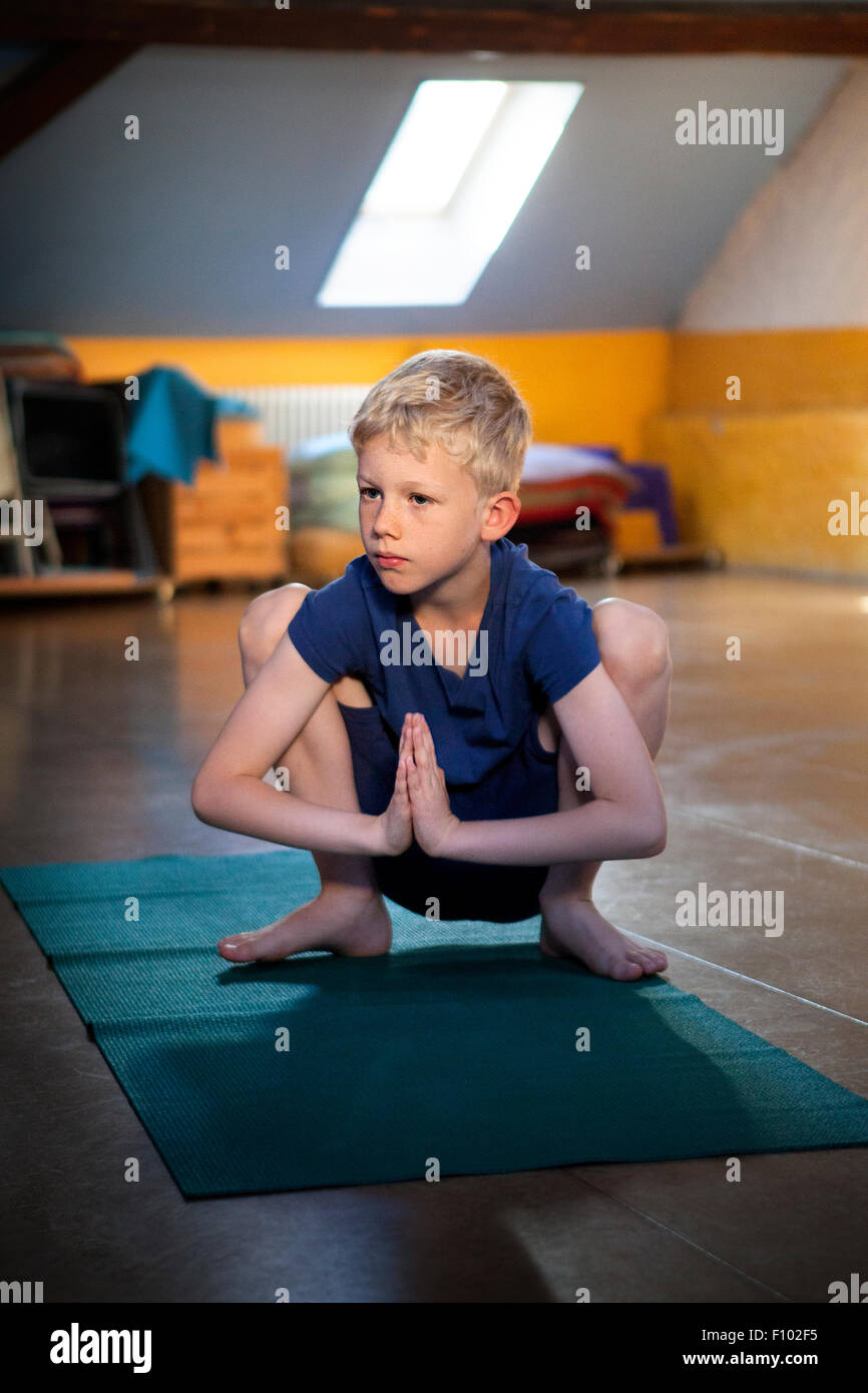 CHILD PRACTICING YOGA Stock Photo - Alamy
