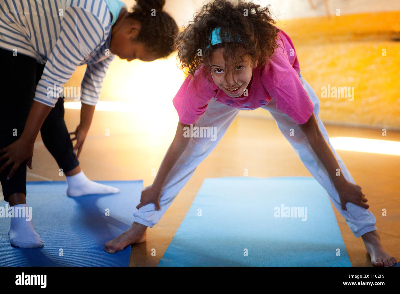 CHILD PRACTICING YOGA Stock Photo - Alamy