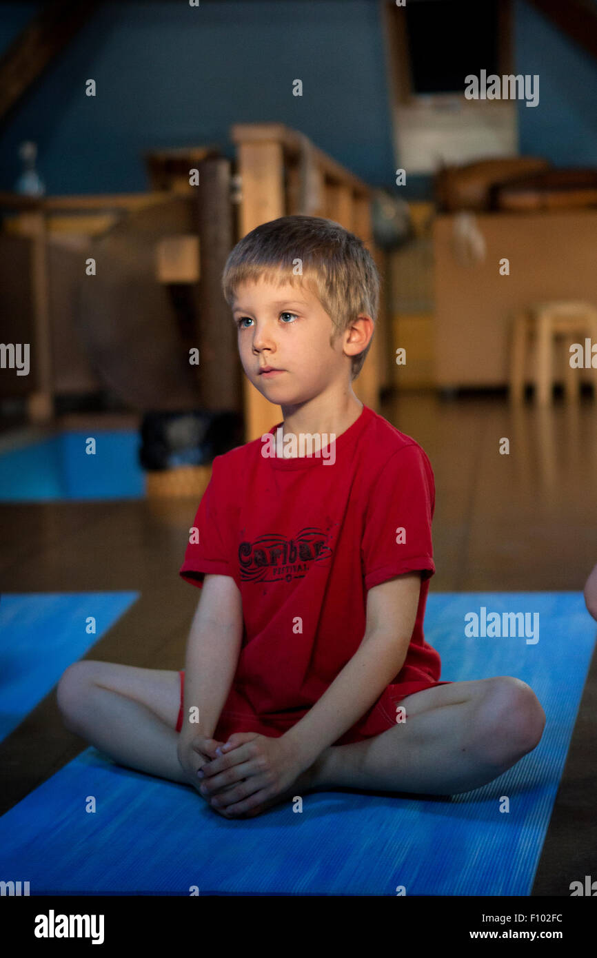 CHILD PRACTICING YOGA Stock Photo - Alamy