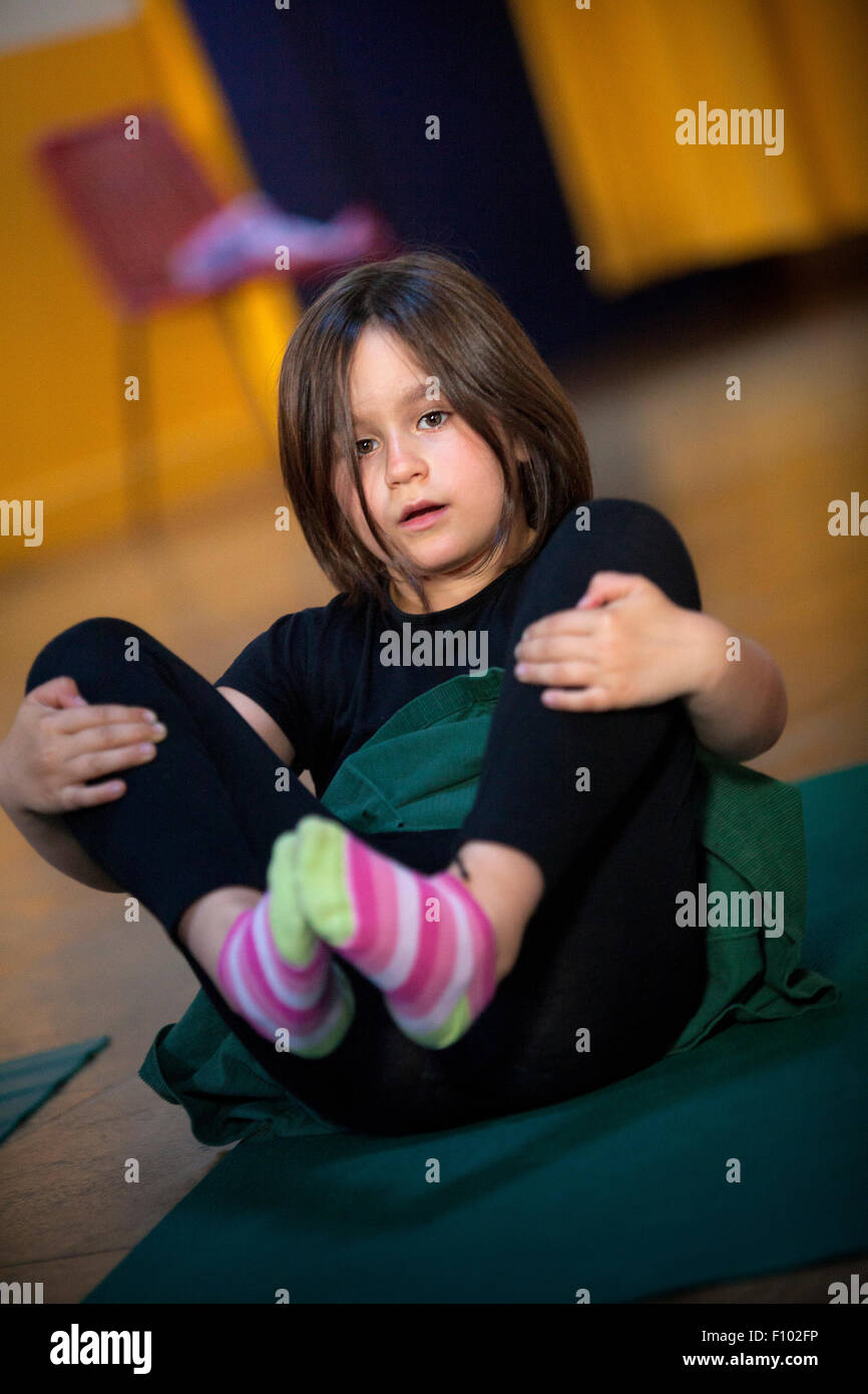 CHILD PRACTICING YOGA Stock Photo - Alamy