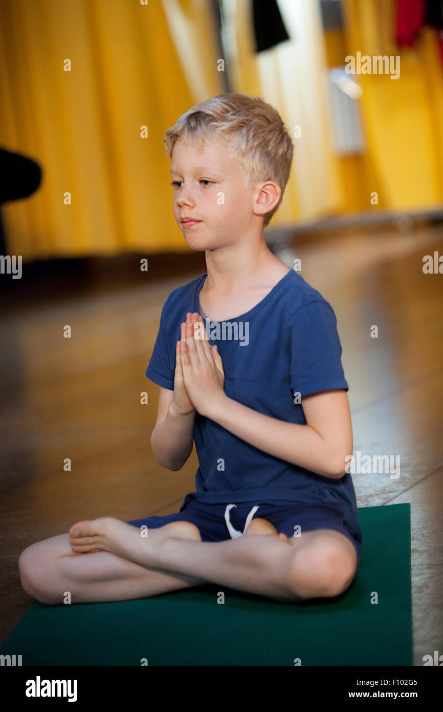 CHILD PRACTICING YOGA Stock Photo - Alamy