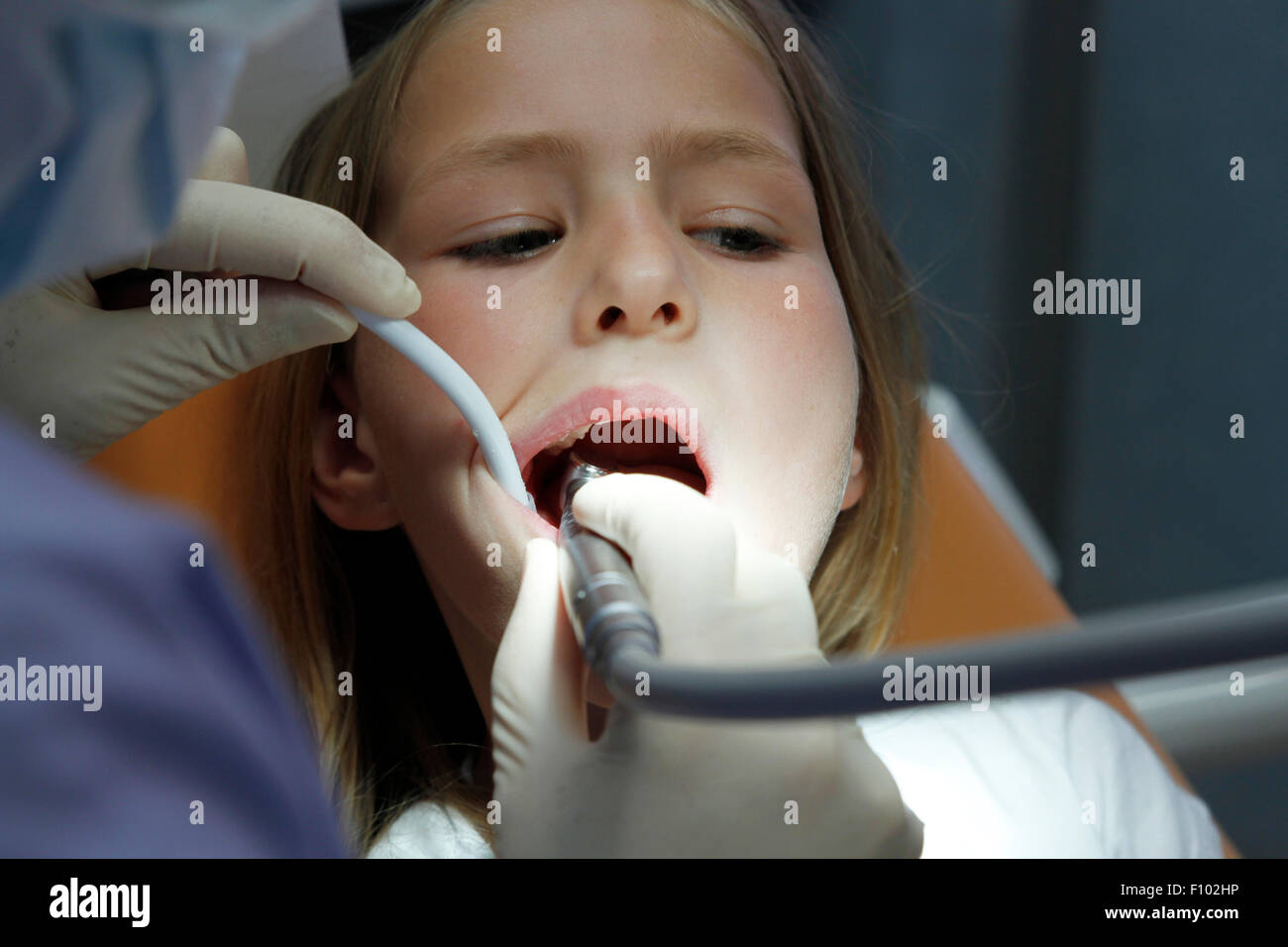 CHILD RECEIVING DENTAL CARE Stock Photo - Alamy