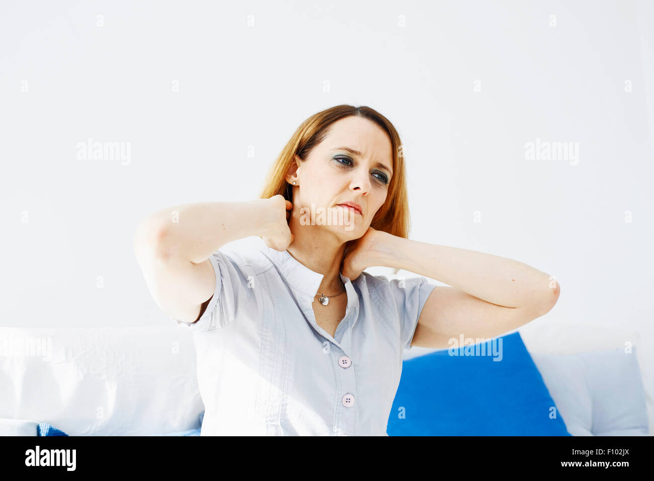 WOMAN WITH CERVICALGIA Stock Photo - Alamy