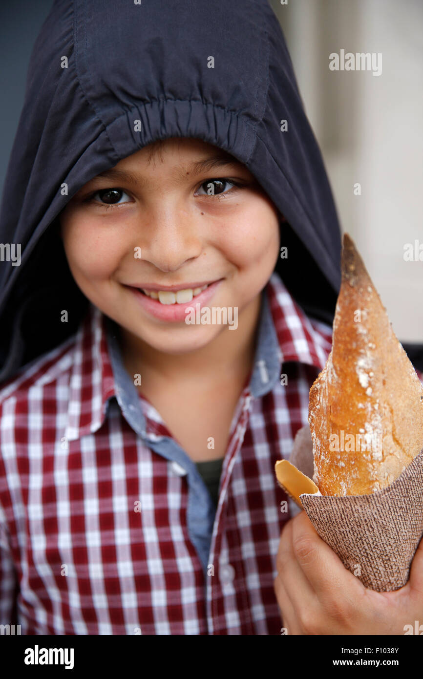 CHILD WITH BREAD Stock Photo - Alamy