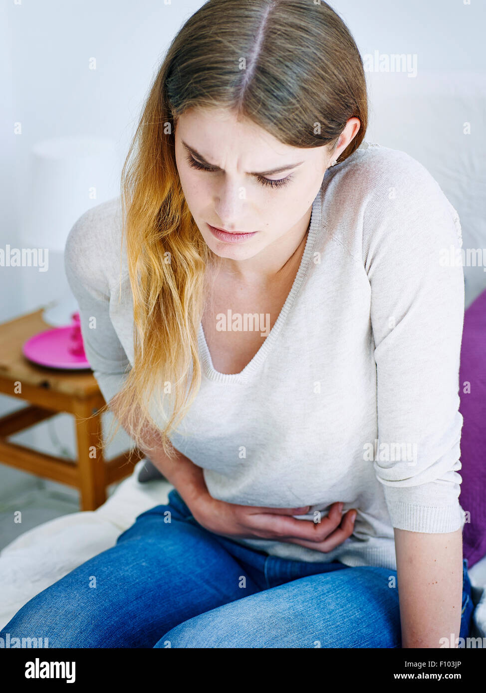 WOMAN WITH ABDOMINAL PAIN Stock Photo - Alamy