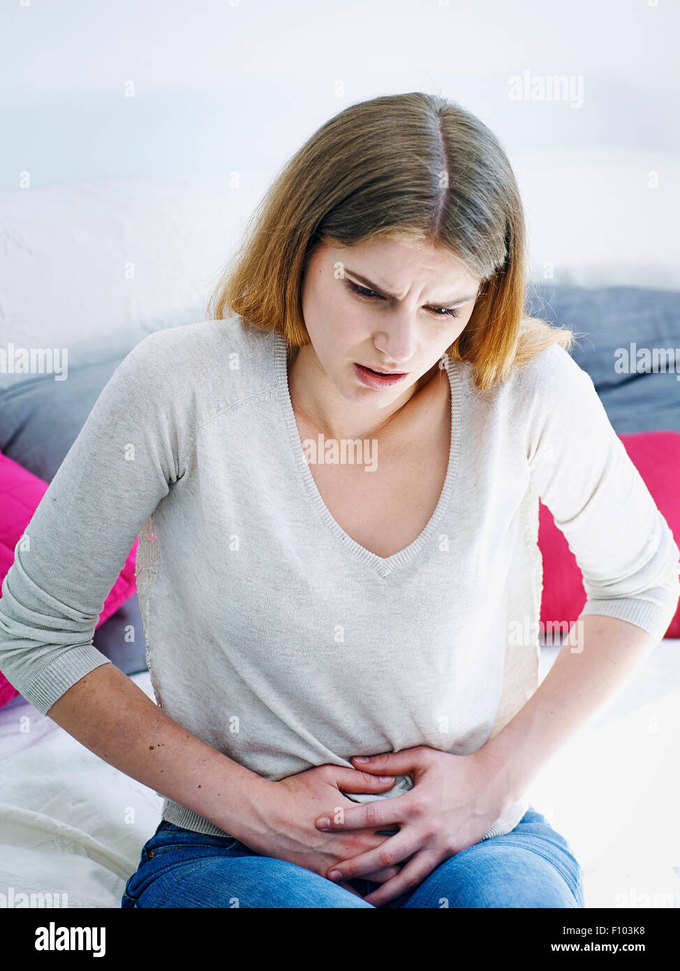 WOMAN WITH ABDOMINAL PAIN Stock Photo - Alamy