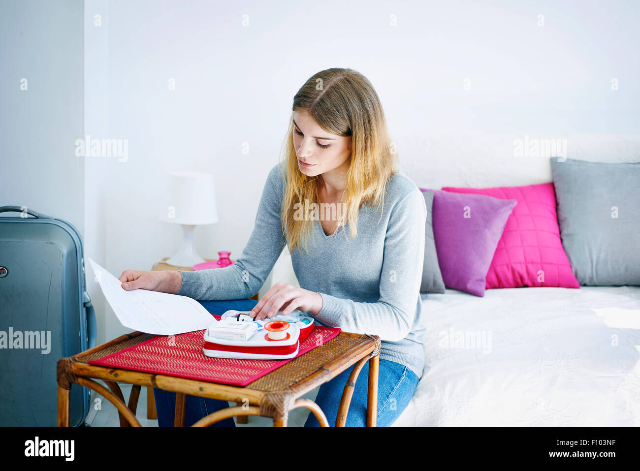 Woman preparing medical kit hi-res stock photography and images - Alamy