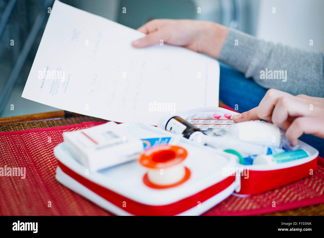 Woman preparing medical kit hi-res stock photography and images - Alamy
