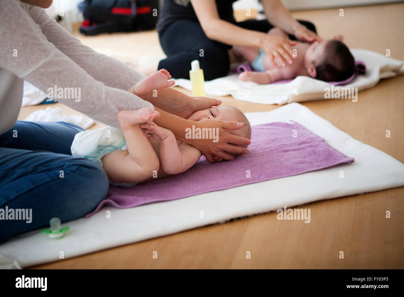 INFANT BEING MASSAGED Stock Photo - Alamy