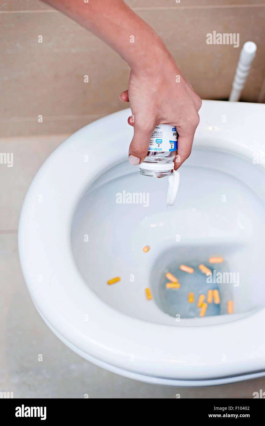 Woman throwing out trash hi-res stock photography and images - Alamy