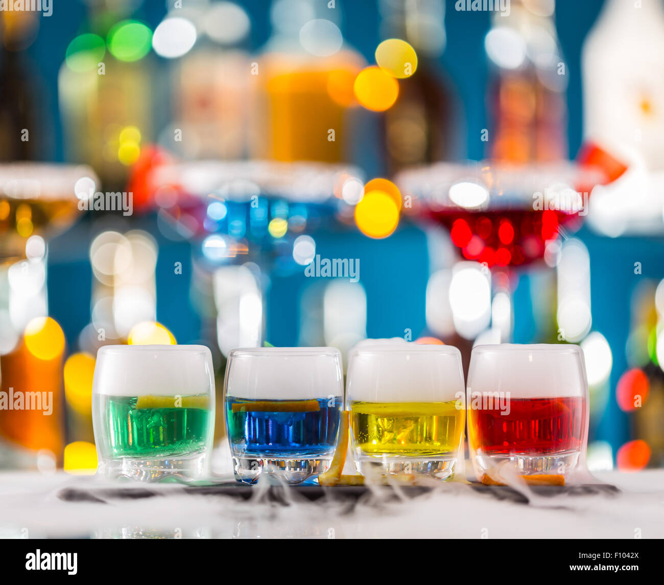 Colored alcoholic shots on bar counter Stock Photo - Alamy