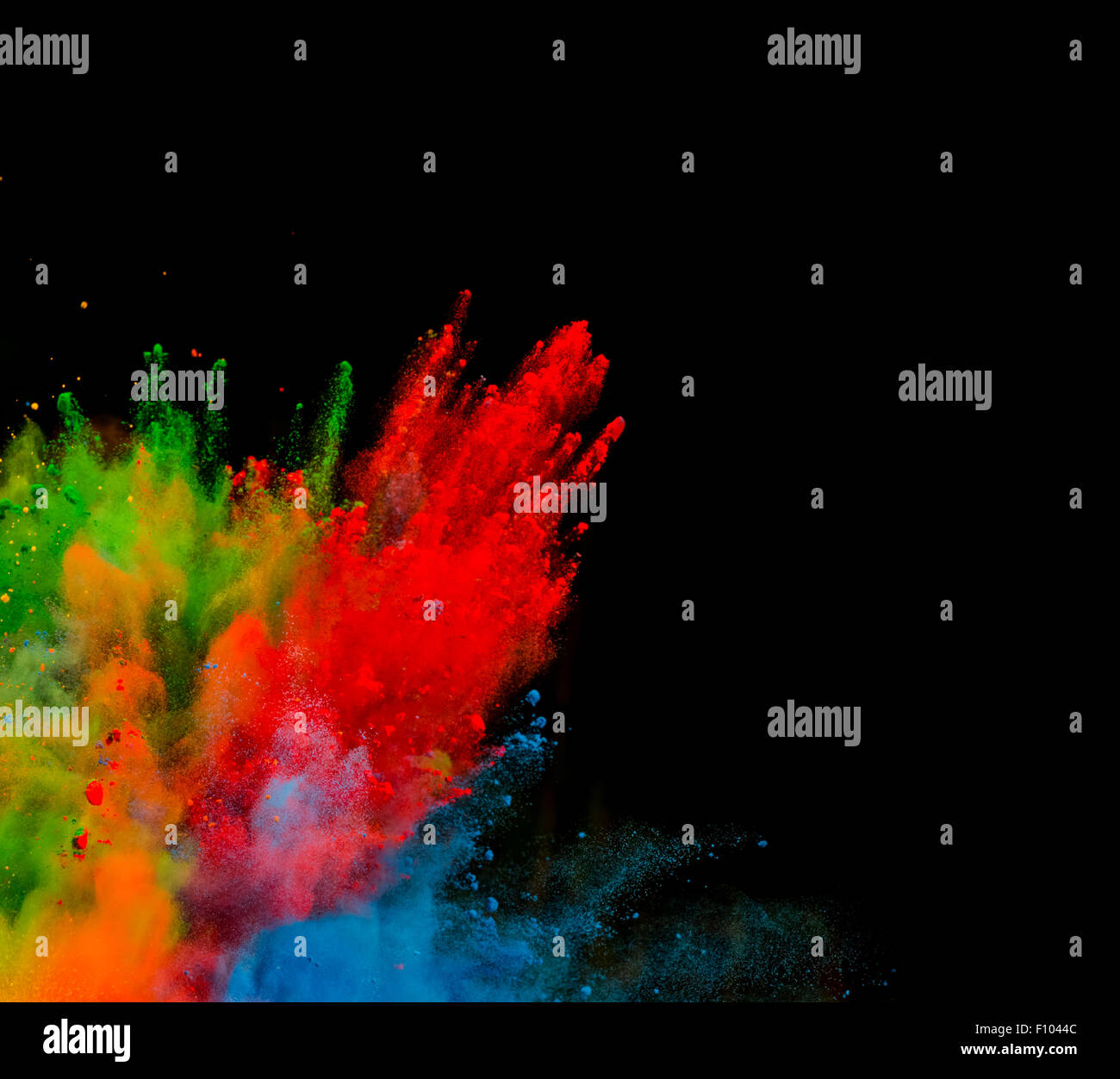 Colored powder on black background Stock Photo - Alamy