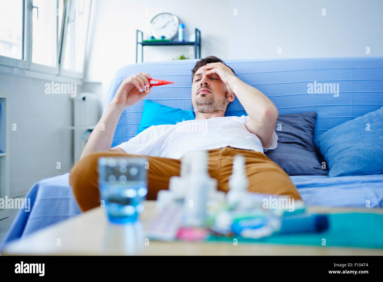 Sick Man Fever Taking Temperature High Resolution Stock Photography and ...