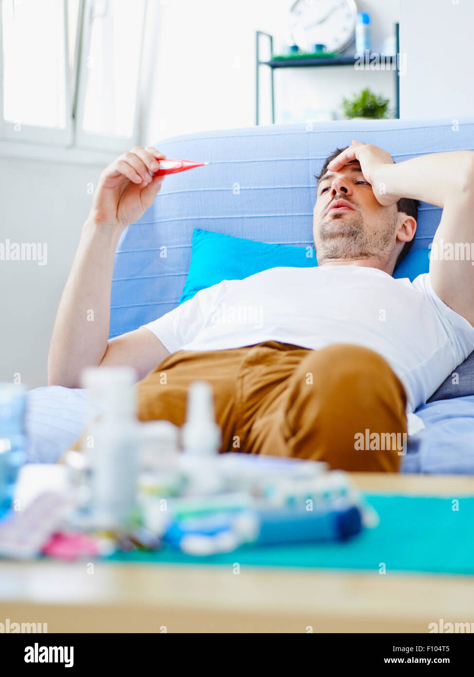 Sick Man Fever Taking Temperature High Resolution Stock Photography and ...