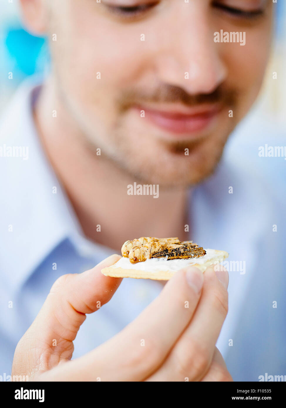 Edible insects man hi-res stock photography and images - Alamy